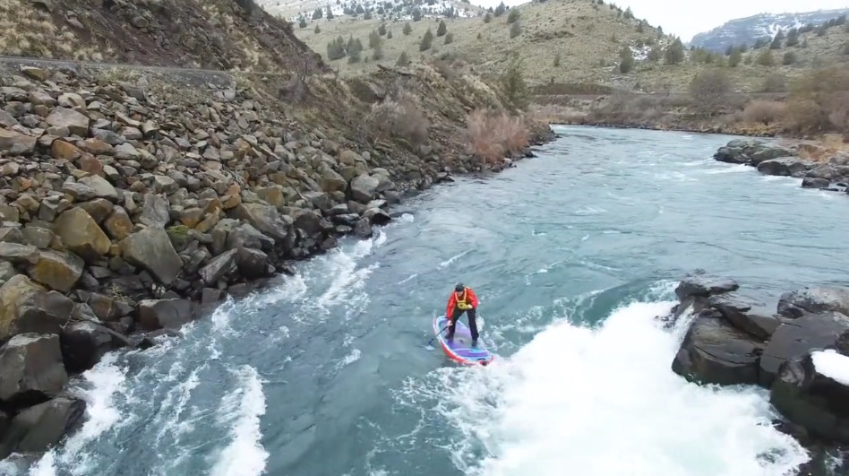 SUP white water paddler Paul Clark heads down Maupin - SUPboarder Magazine